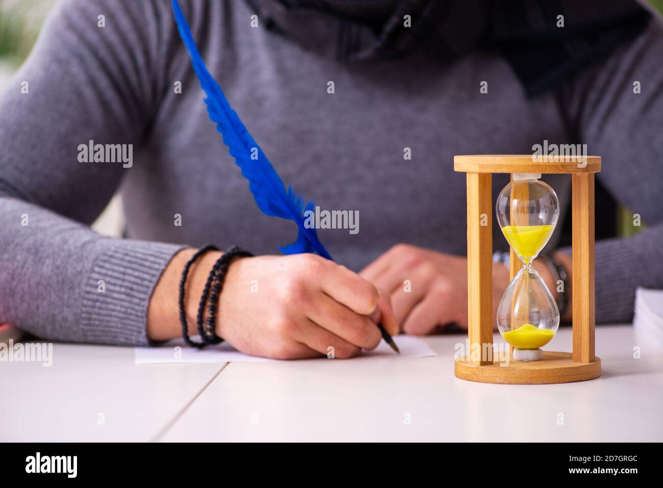 Male writer in time management concept Stock Photo - Alamy