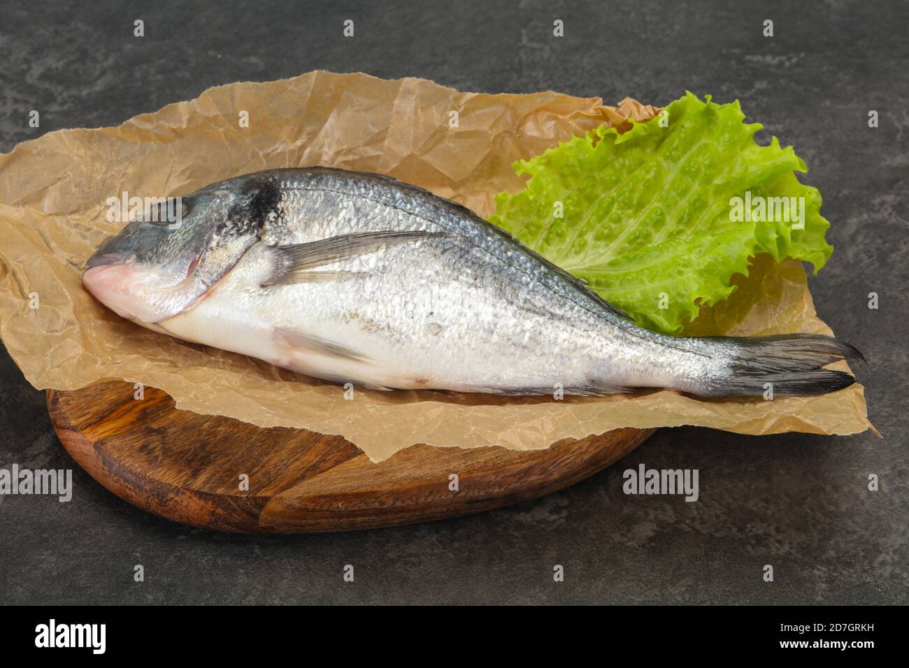 Raw Dorada fish ready for cooking Stock Photo - Alamy