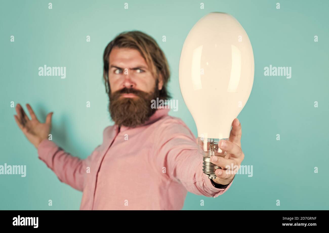 bearded thinking man hold bulb. Energy saving. innovative idea and ...