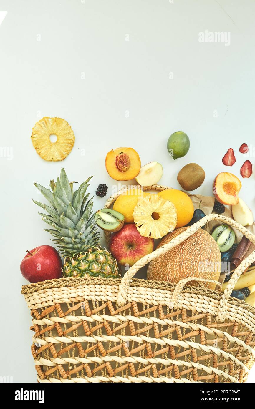 Stylish eco bag with fresh fruits on white background Stock Photo - Alamy