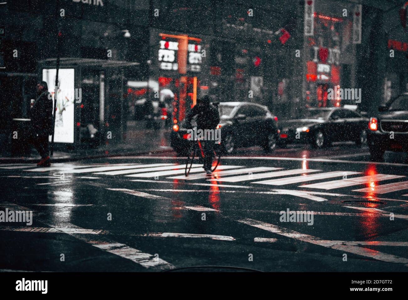 Raining road with traffic lights at night. City life on a rainy day ...