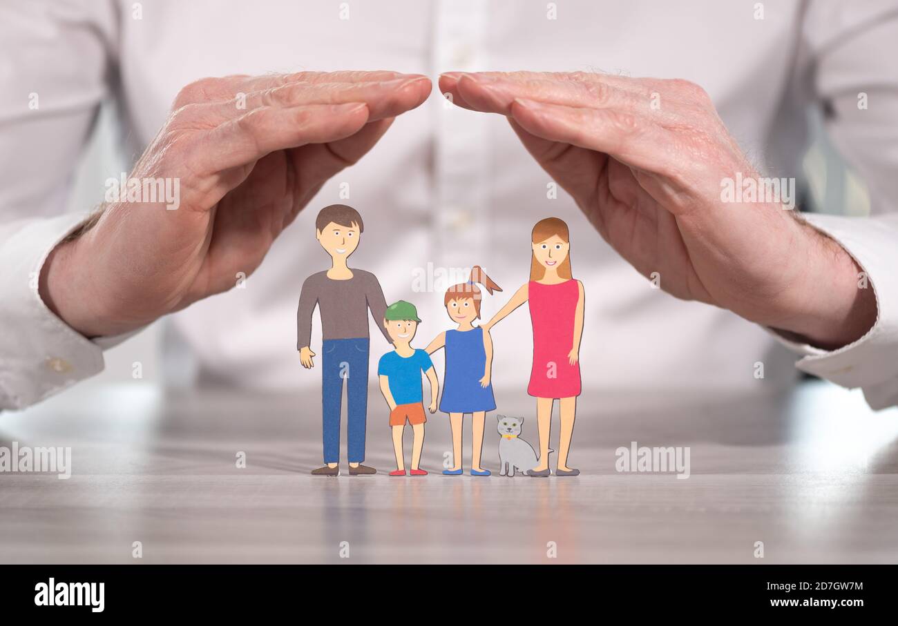 Insurer protecting a family with his hands Stock Photo - Alamy