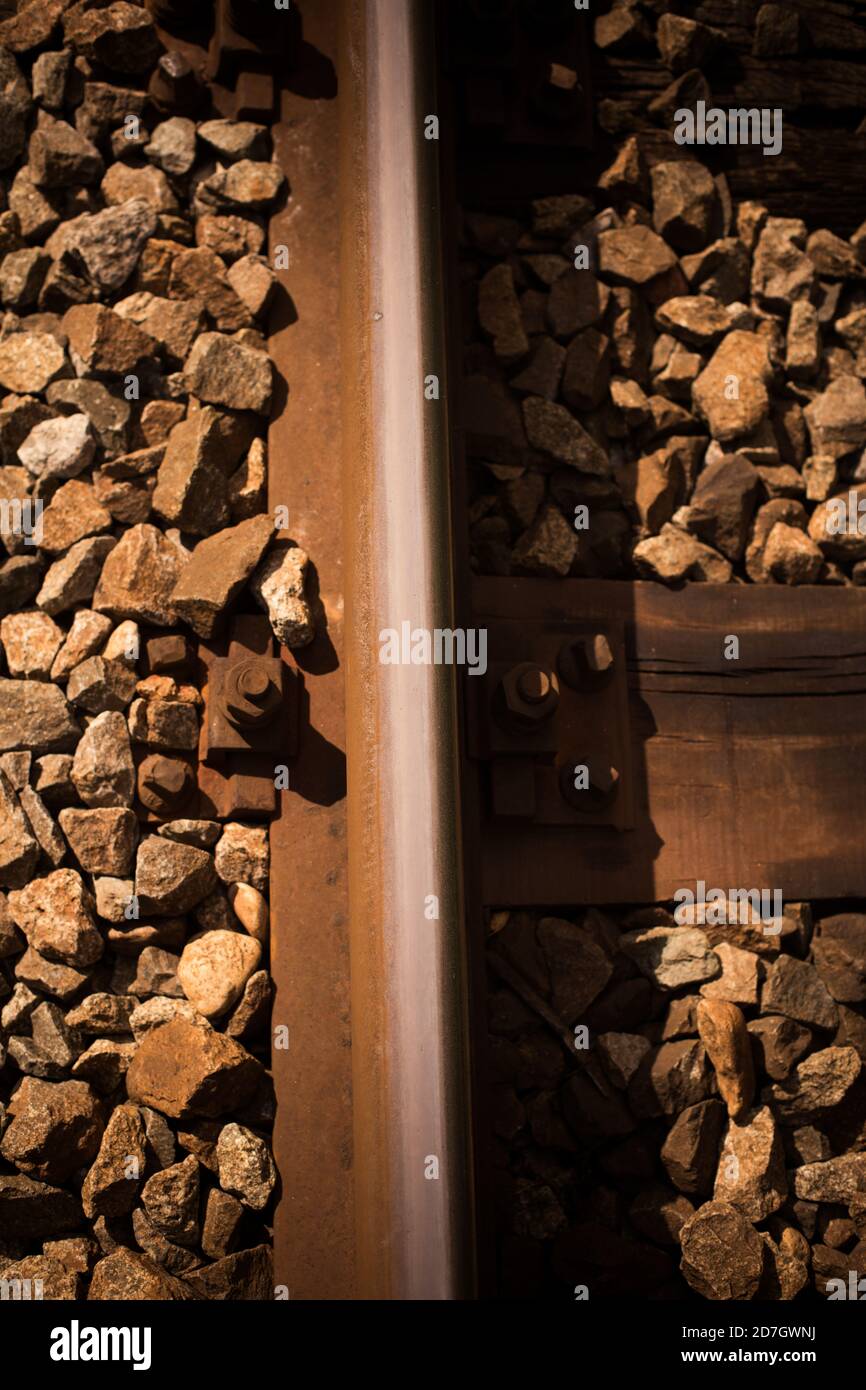Color close up image of a railroad track, with stones Stock Photo - Alamy