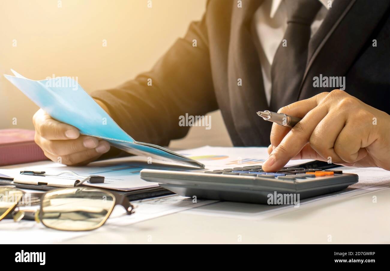 Business people or accountants who are reviewing financial documents ...
