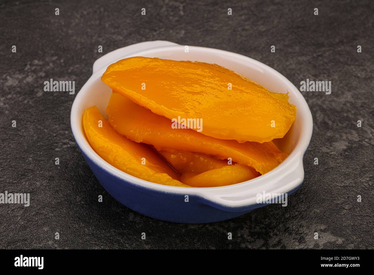 Sweet delicous mango slices in syrop Stock Photo - Alamy