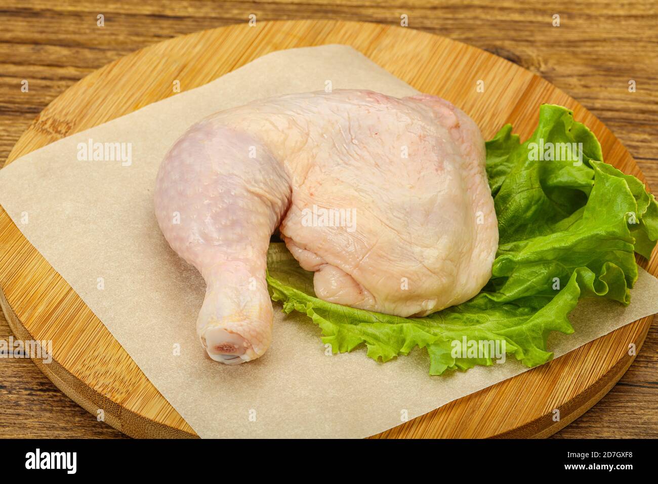 Raw chicken leg for cooking served salad leaves Stock Photo - Alamy