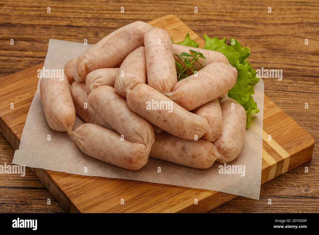 Raw natural chicken baby sausages for roast Stock Photo - Alamy