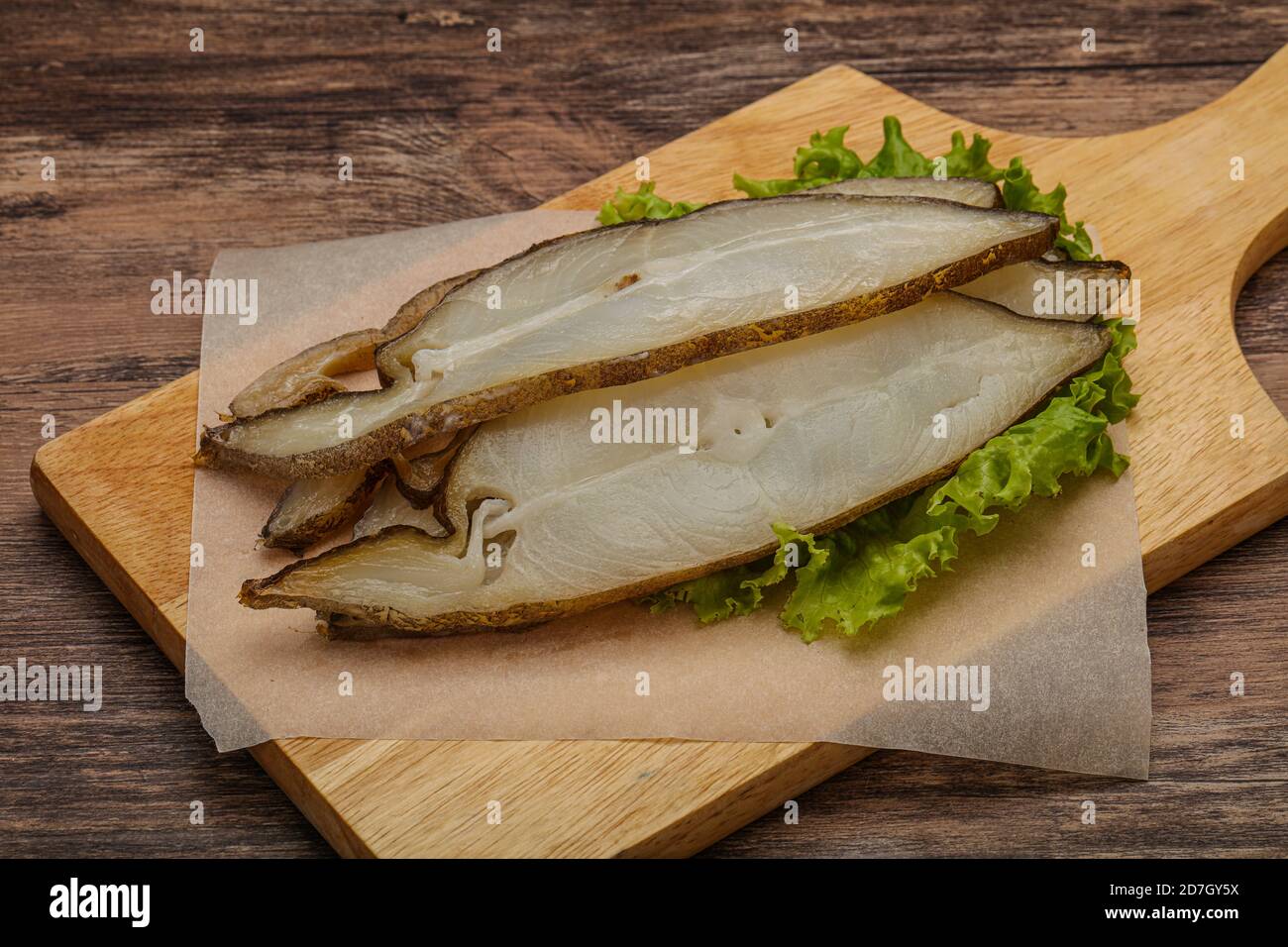Delicous smoked halibut fish slices snack Stock Photo - Alamy
