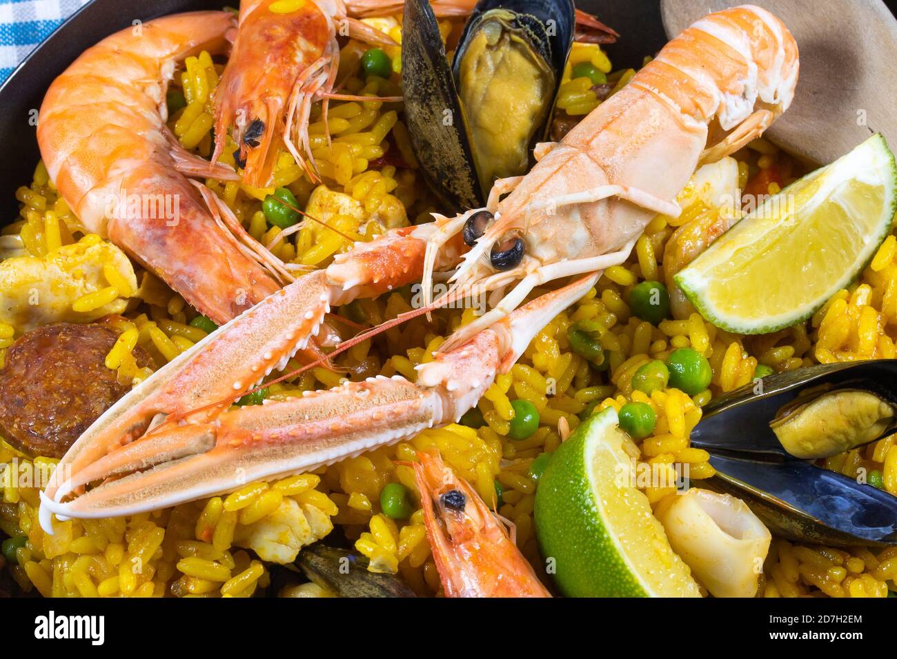 Pan filled paella on wooden hi-res stock photography and images - Alamy