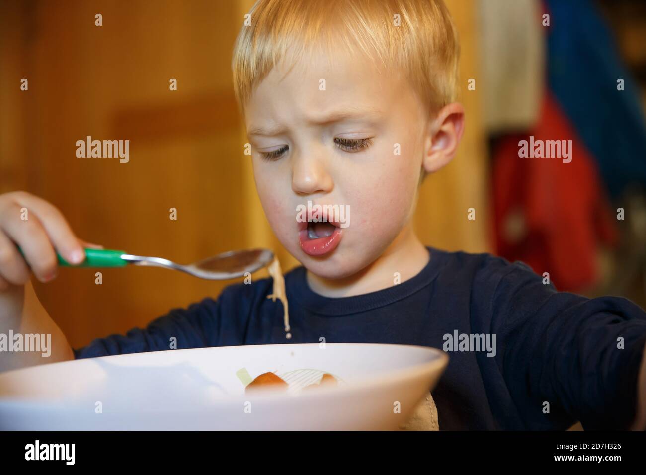 Little boy refusing to eat Stock Photo - Alamy