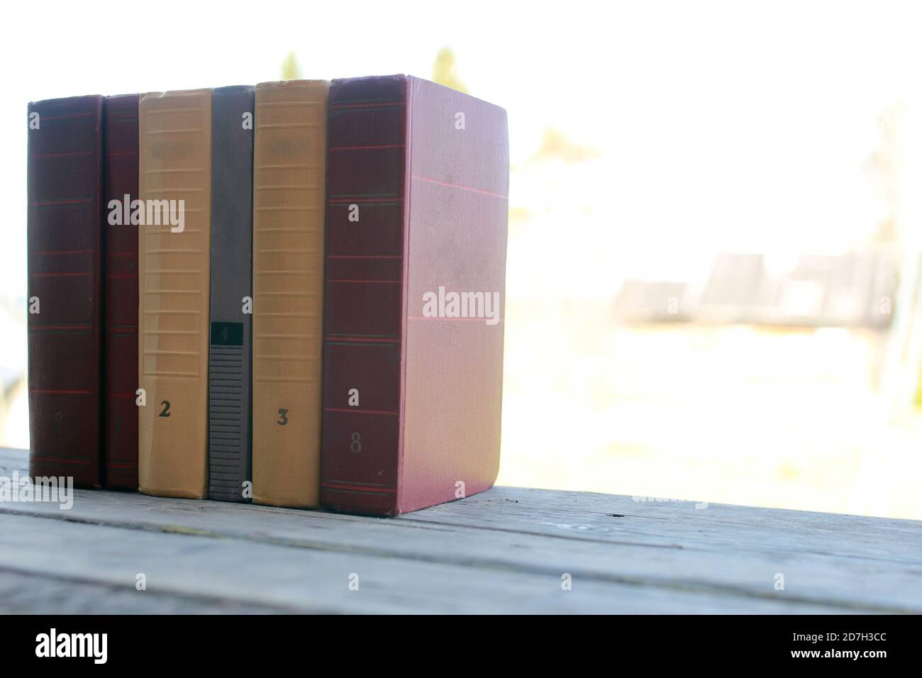 books standing on a table Stock Photo - Alamy