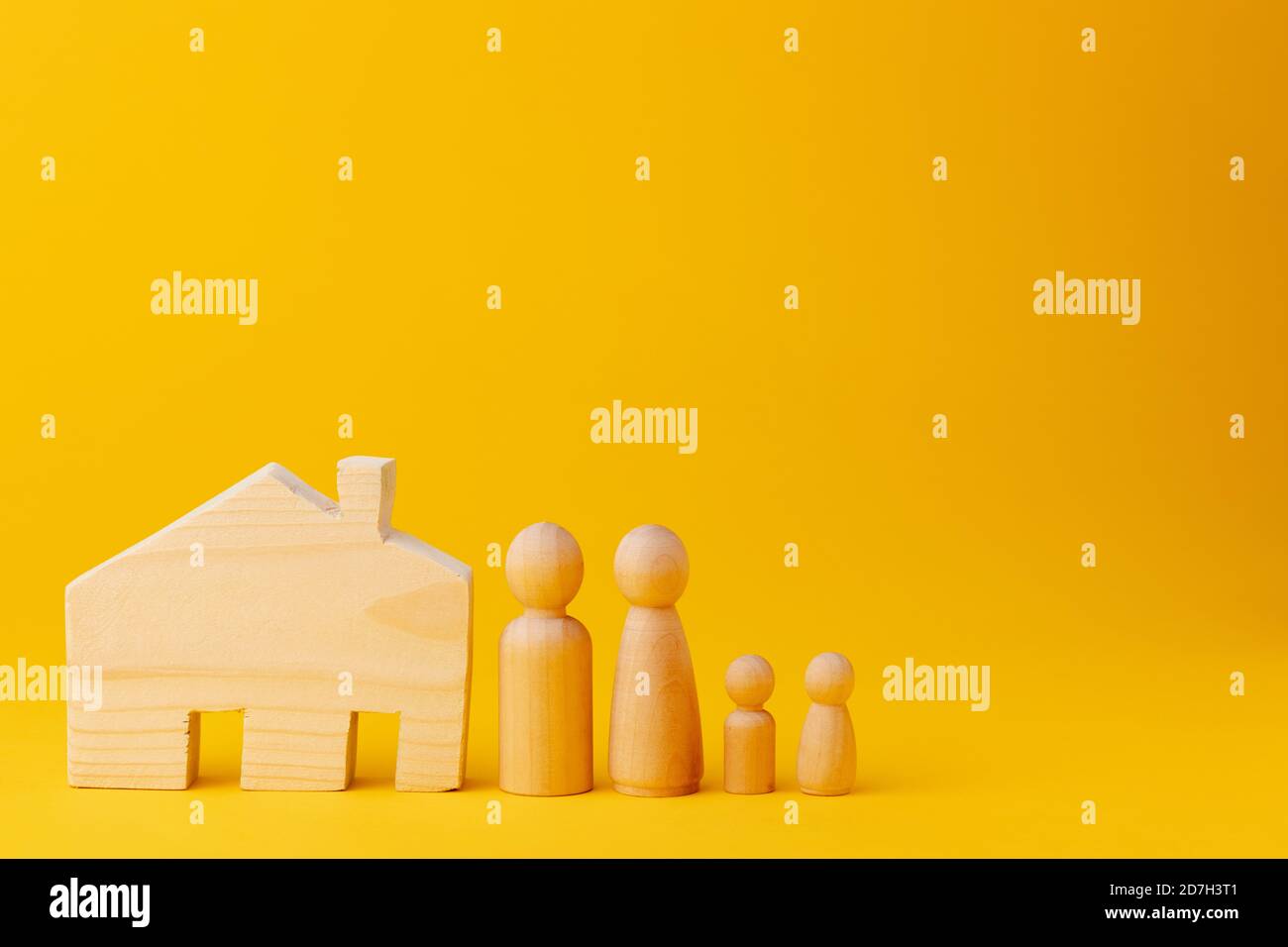 Wooden men figures and toy wooden house Stock Photo - Alamy