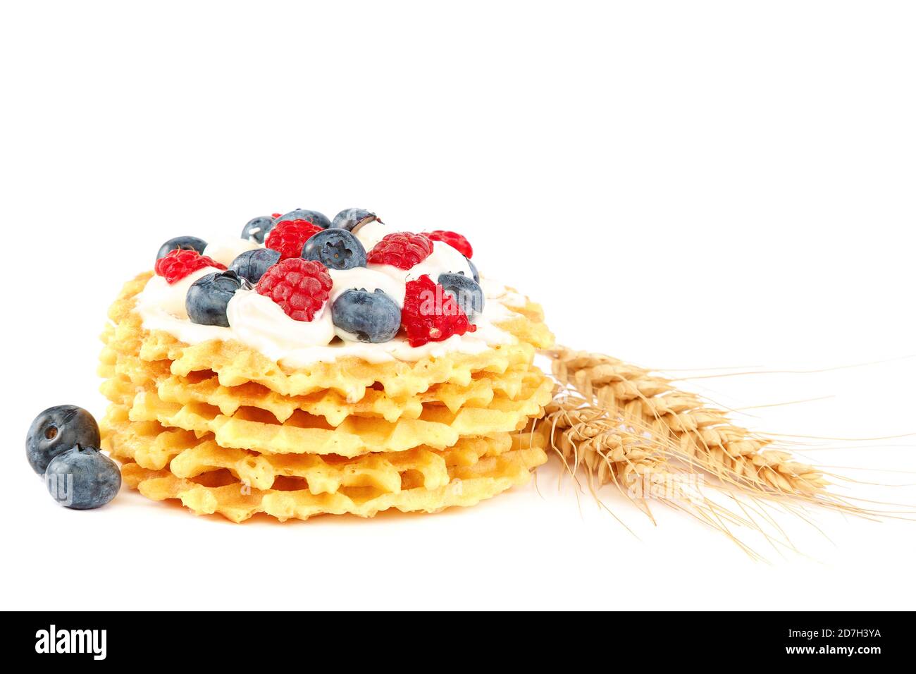 Fresh blueberries, raspberries and waffle cookies isolated on a white ...