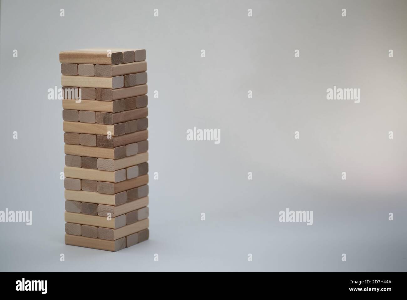 Board game jenga tower of light wood sticks Stock Photo - Alamy