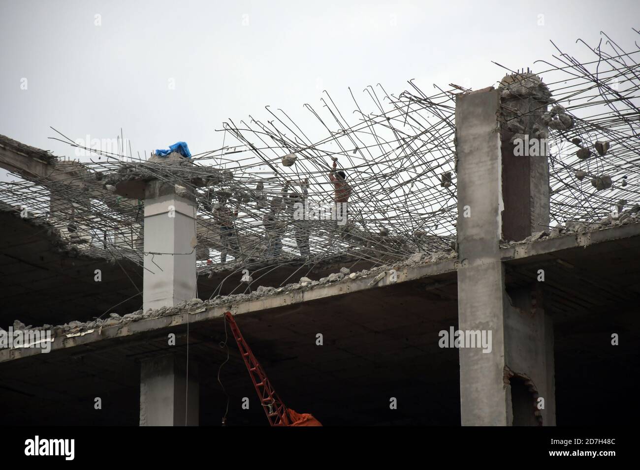 DHAKA, BANGLADESH– 21 October 2020: Bangladeshi worker uses a sledge ...