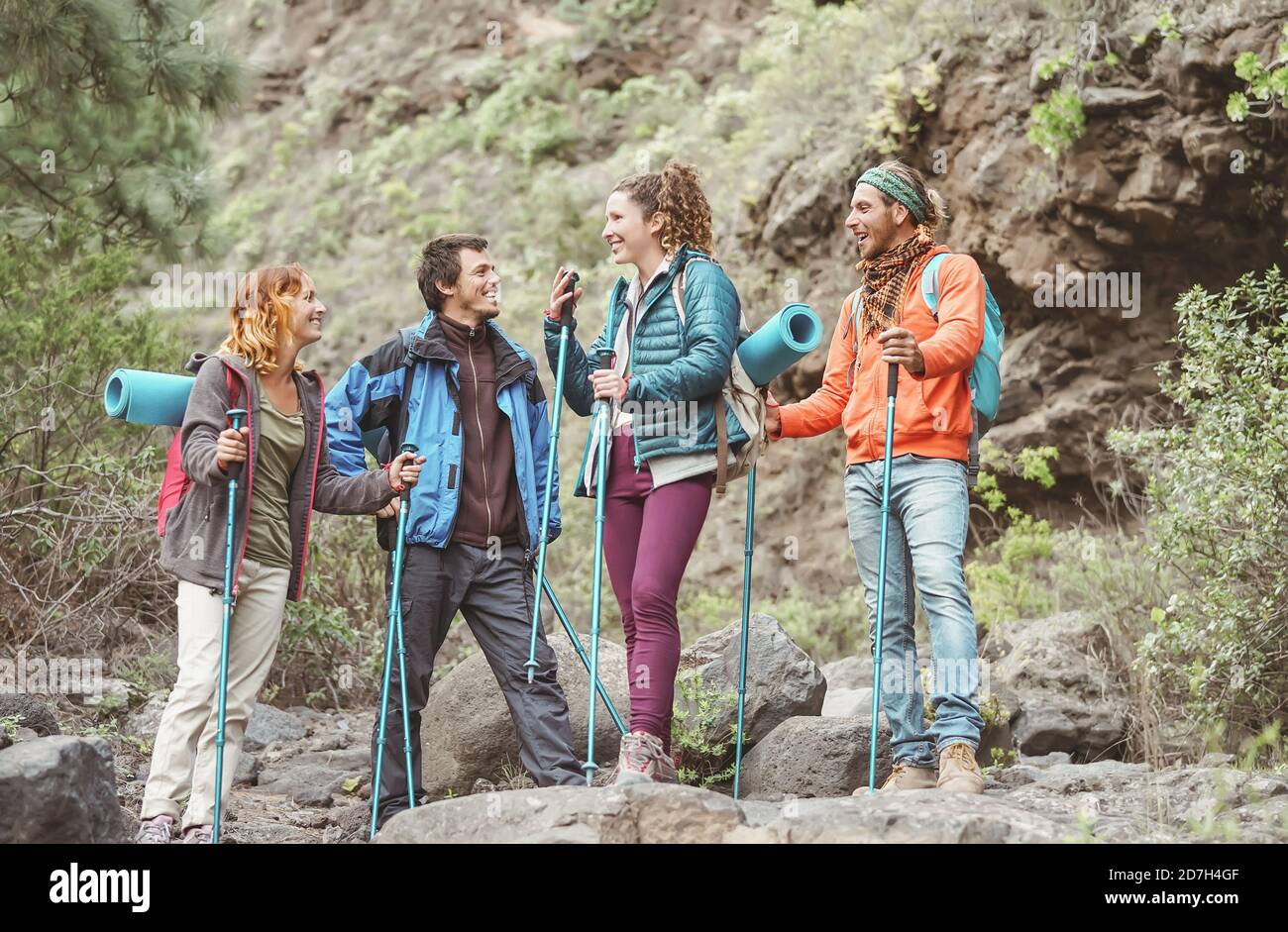 Happy work team friends doing trekking excursion on mountains - Group ...