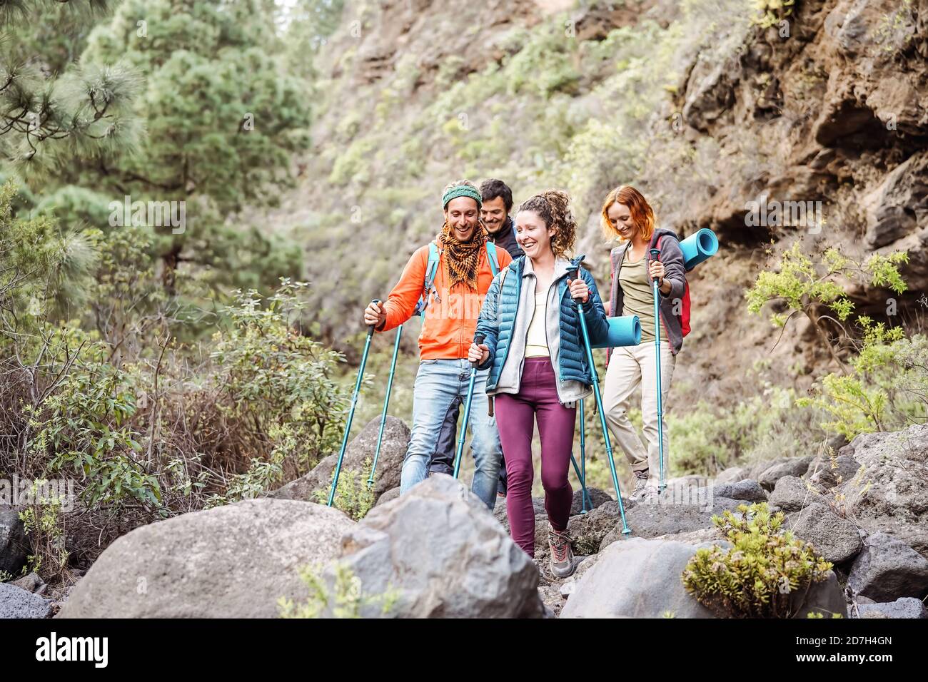 Happy team friends doing trekking excursion on mountains - Group young ...