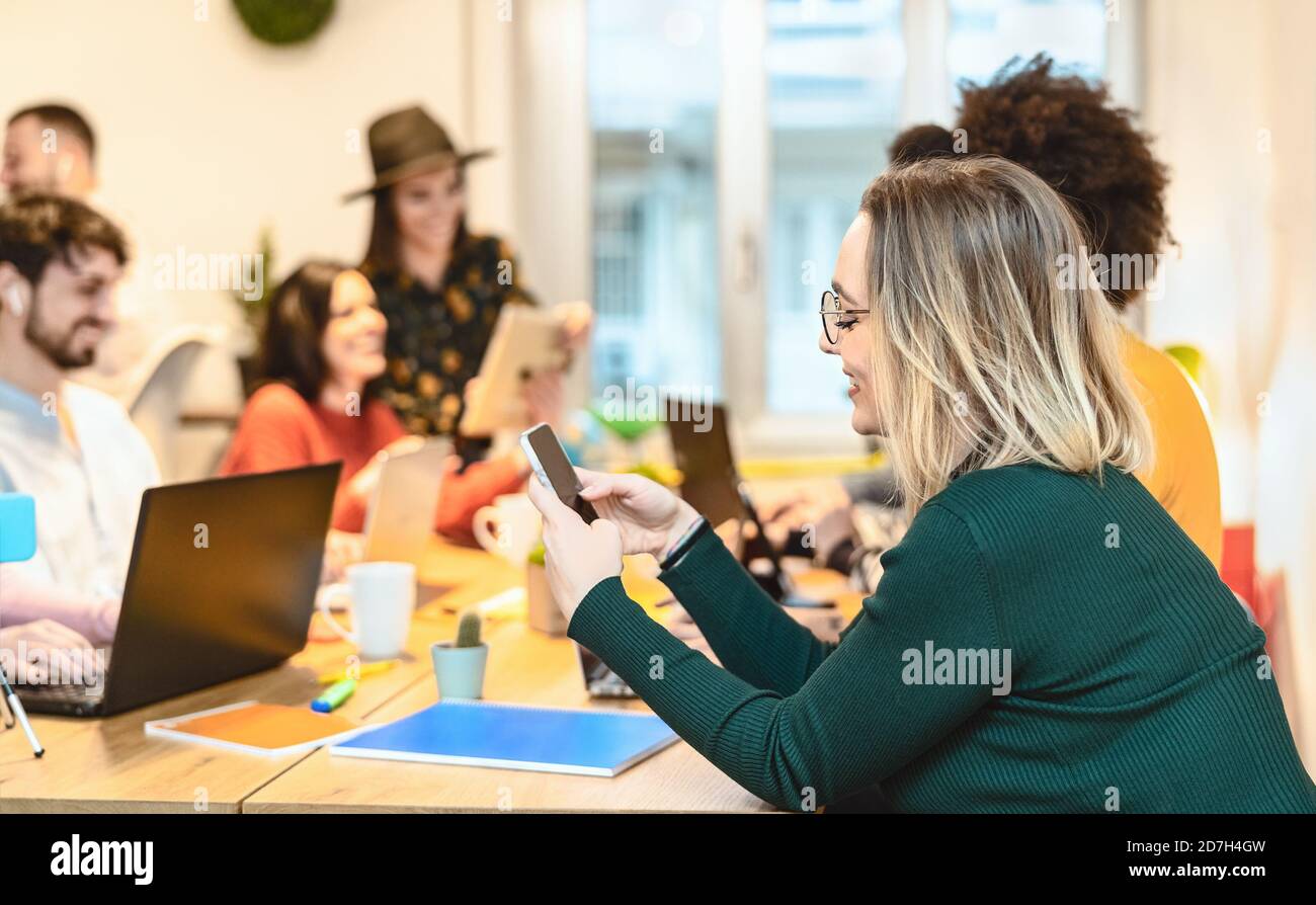 Young friends working together inside co-working creative space ...