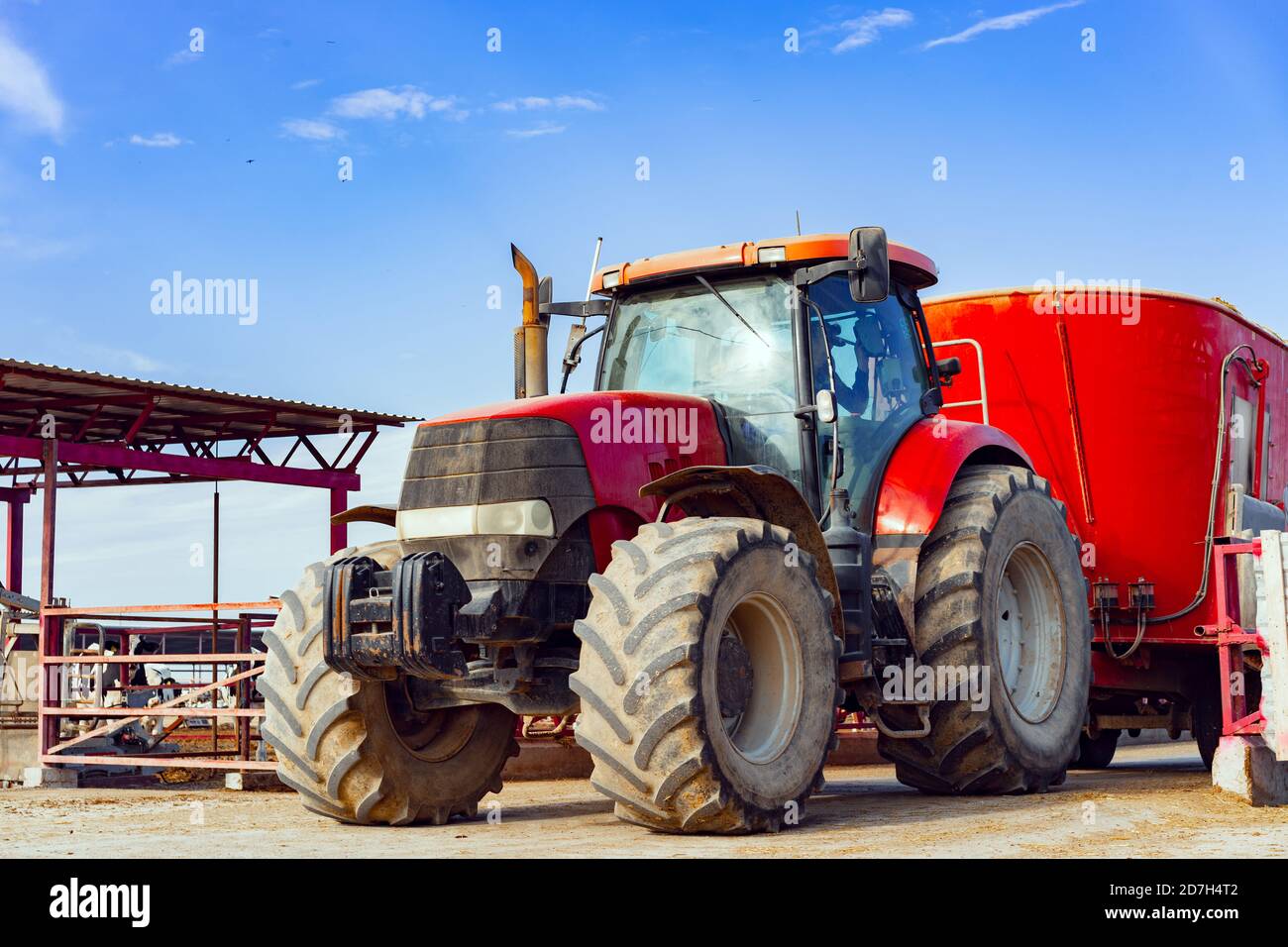 Modern red agricultural tractor in a farm Stock Photo - Alamy