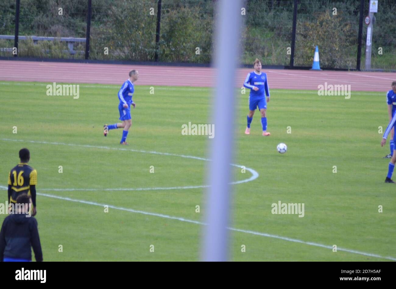 Mixed group playing football at stadium hi-res stock photography and ...