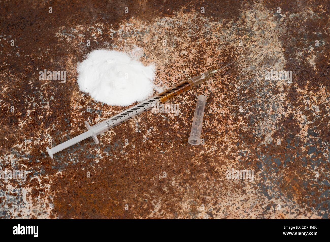 Syringe and drugs on dirty rusty background. Injection syringe ...