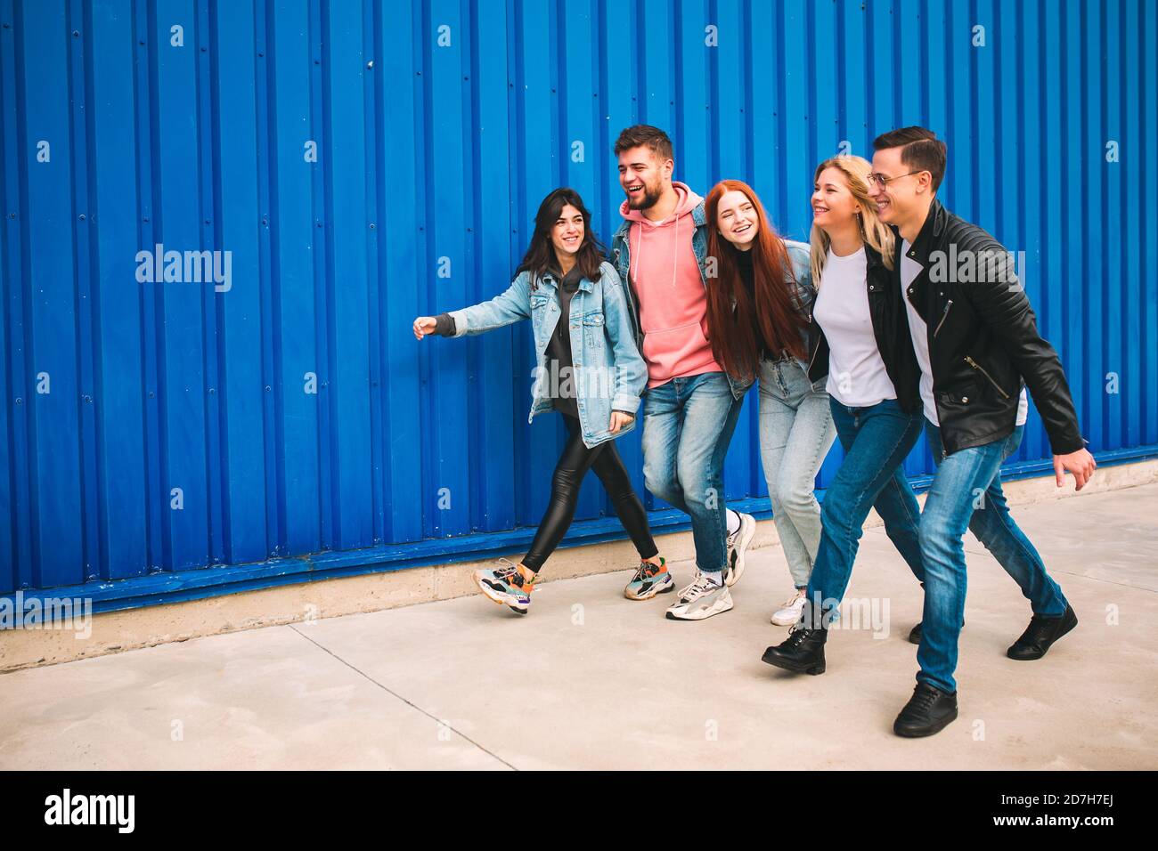 Youth culture. Group of four young diverse friends in jeanse outfit ...