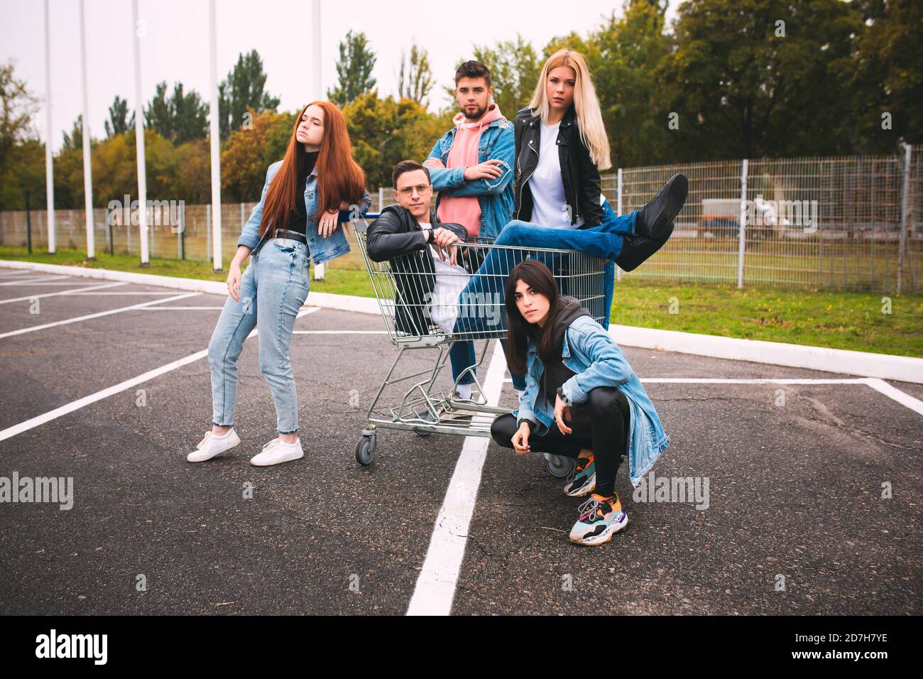 Youth culture. Group of four young diverse friends in jeanse outfit ...