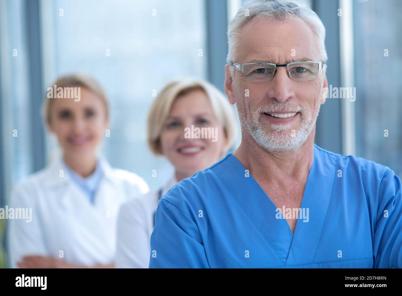Group of smiling medical workers standing inside the hospital Stock ...