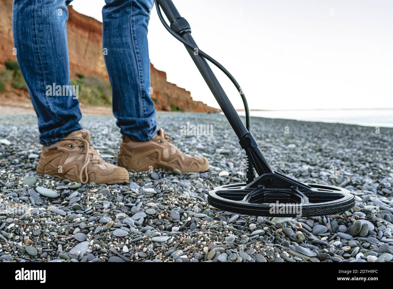Metal detector coil in action above the ground Stock Photo - Alamy