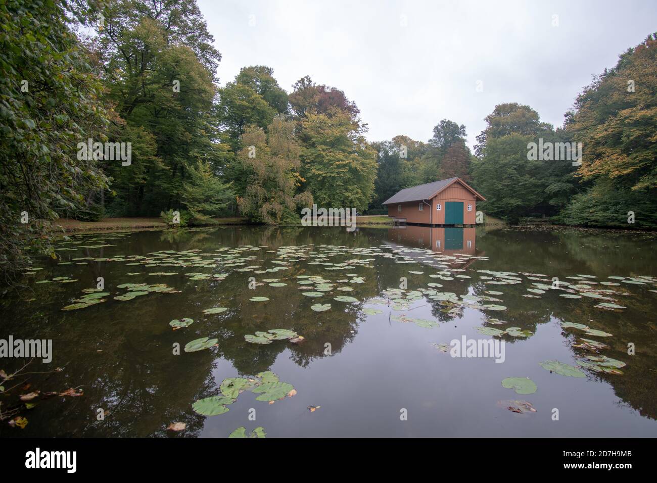 Scenic landscape of a Bremen park with a small lake surrounded by ...