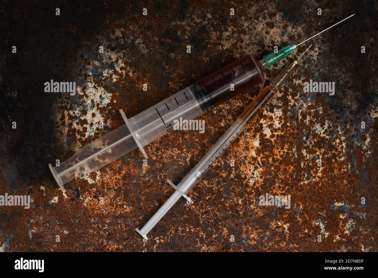 Syringe and drugs on dirty rusty background. Injection syringe ...