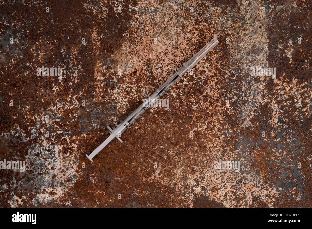 Syringe and drugs on dirty rusty background. Injection syringe ...
