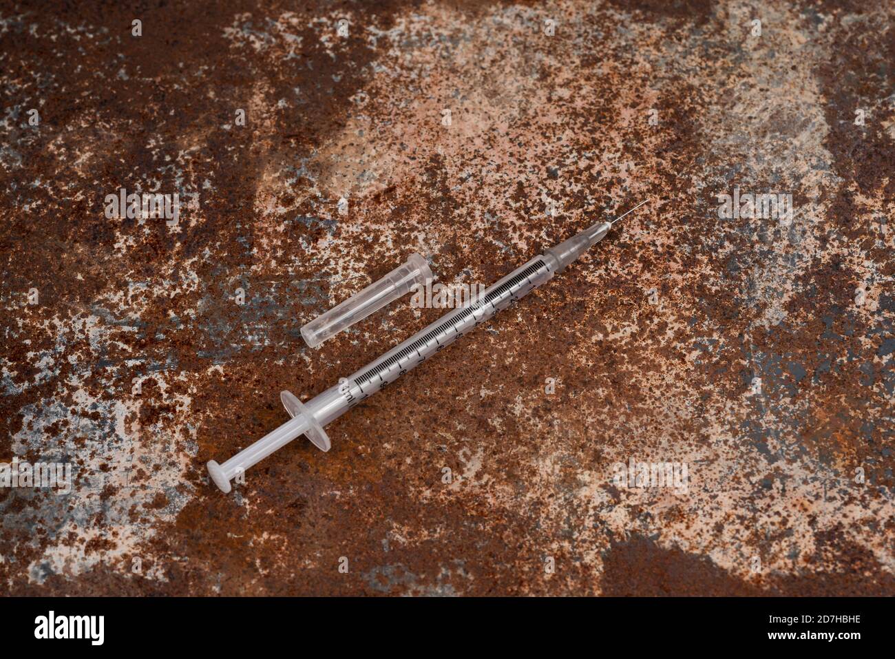 Syringe and drugs on dirty rusty background. Injection syringe ...