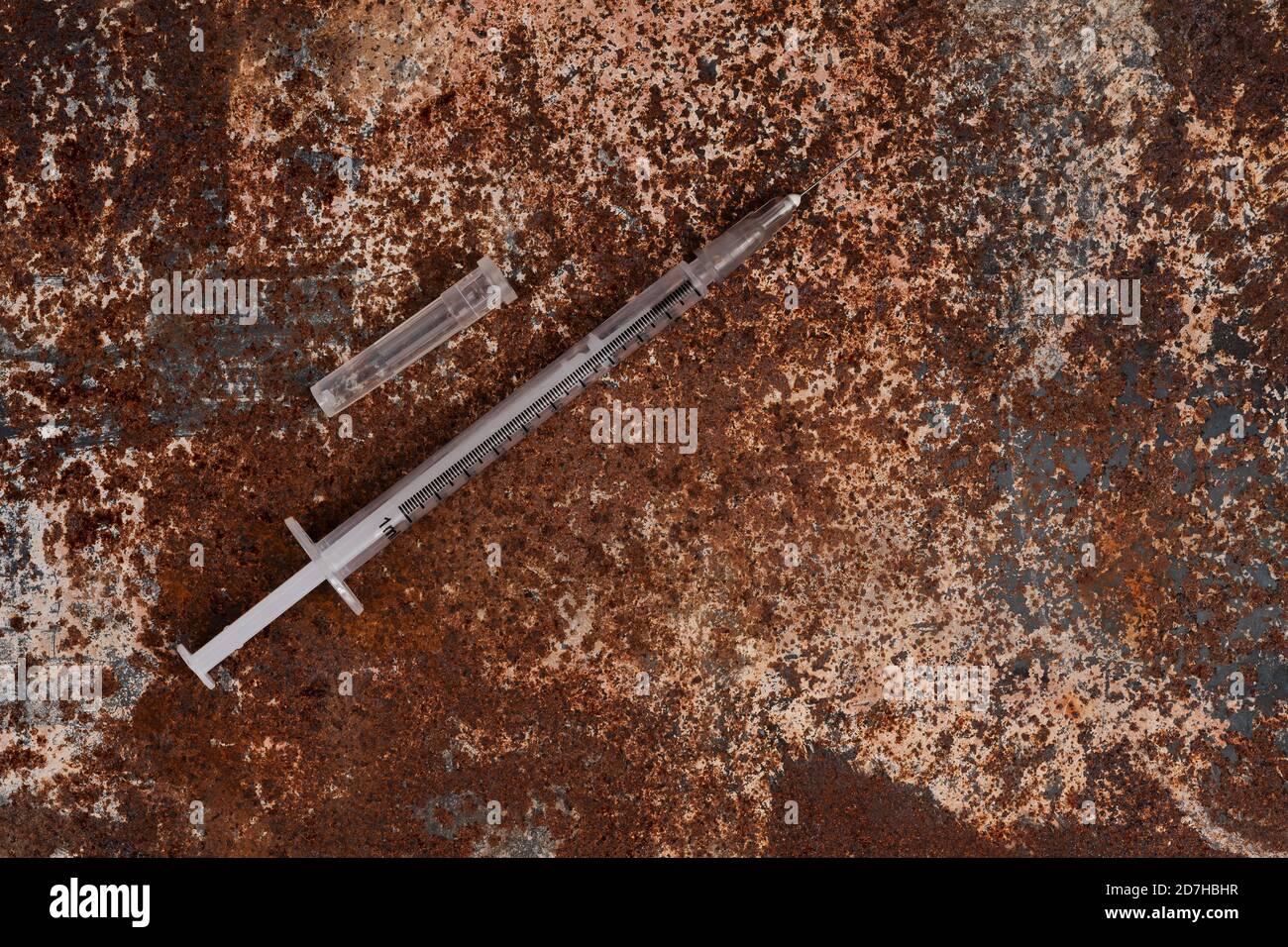 Syringe and drugs on dirty rusty background. Injection syringe ...