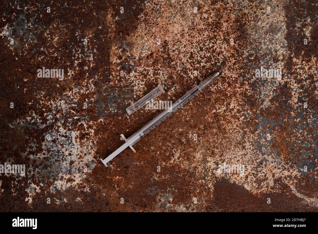 Syringe and drugs on dirty rusty background. Injection syringe ...