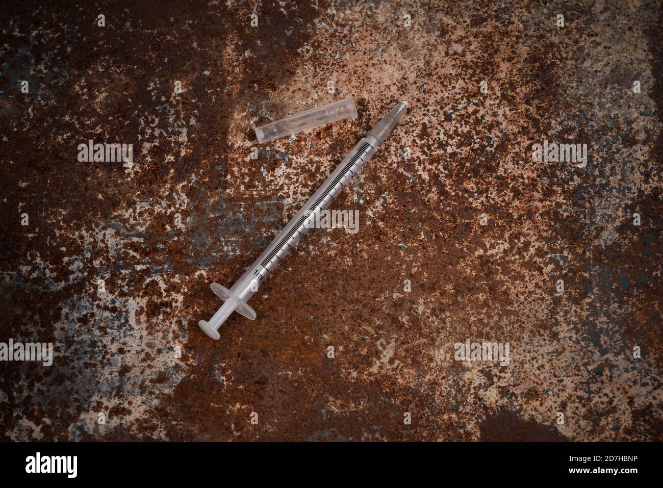 Syringe and drugs on dirty rusty background. Injection syringe ...