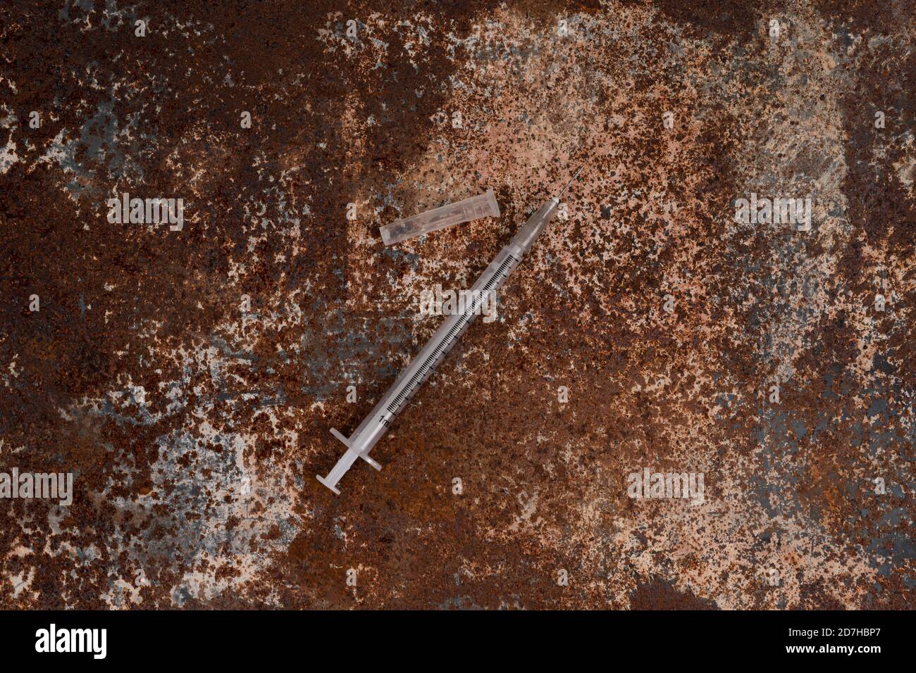 Syringe and drugs on dirty rusty background. Injection syringe ...