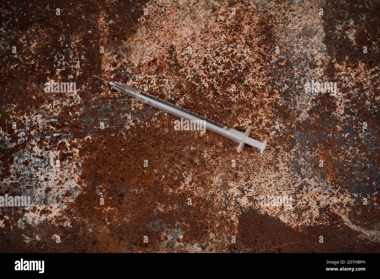 Syringe and drugs on dirty rusty background. Injection syringe ...