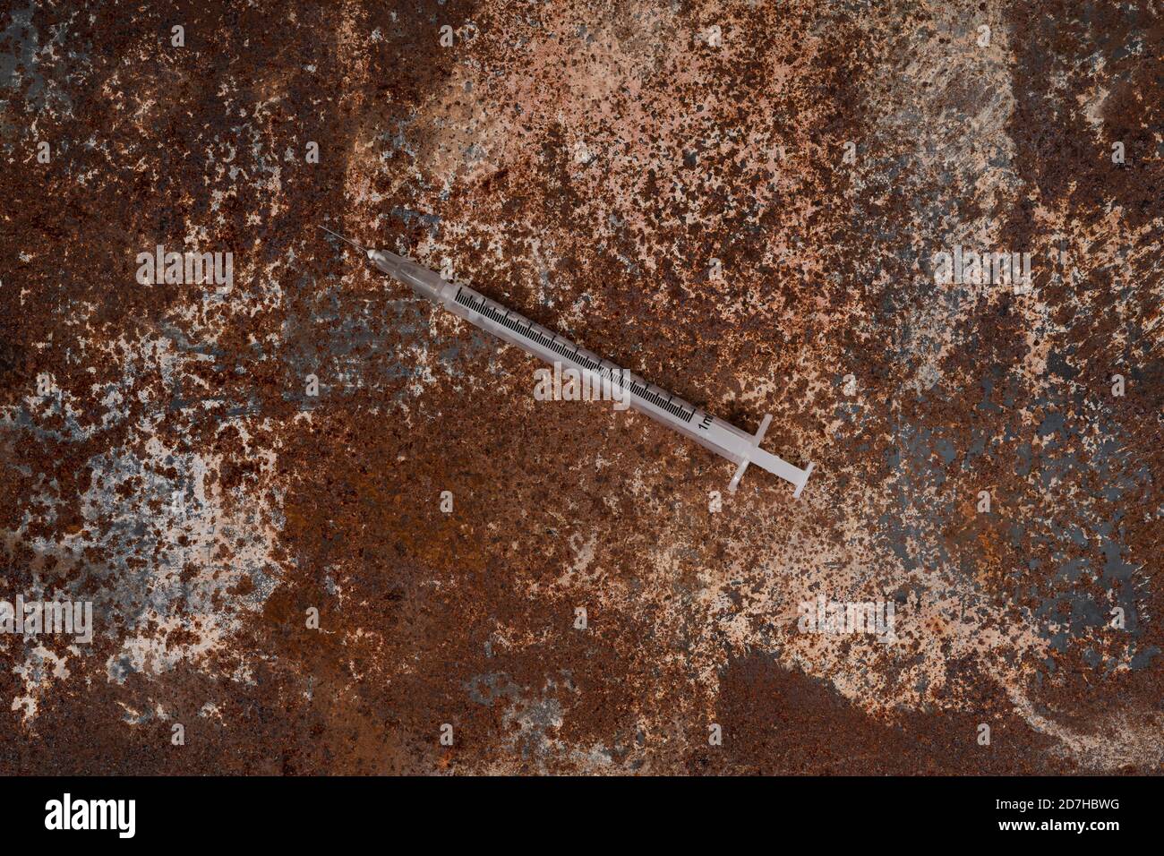 Syringe and drugs on dirty rusty background. Injection syringe ...