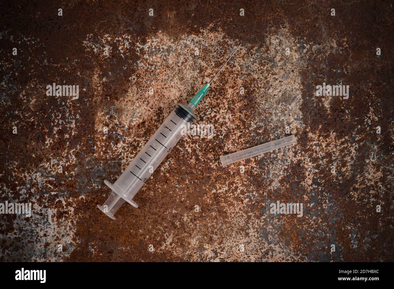 Syringe and drugs on dirty rusty background. Injection syringe ...