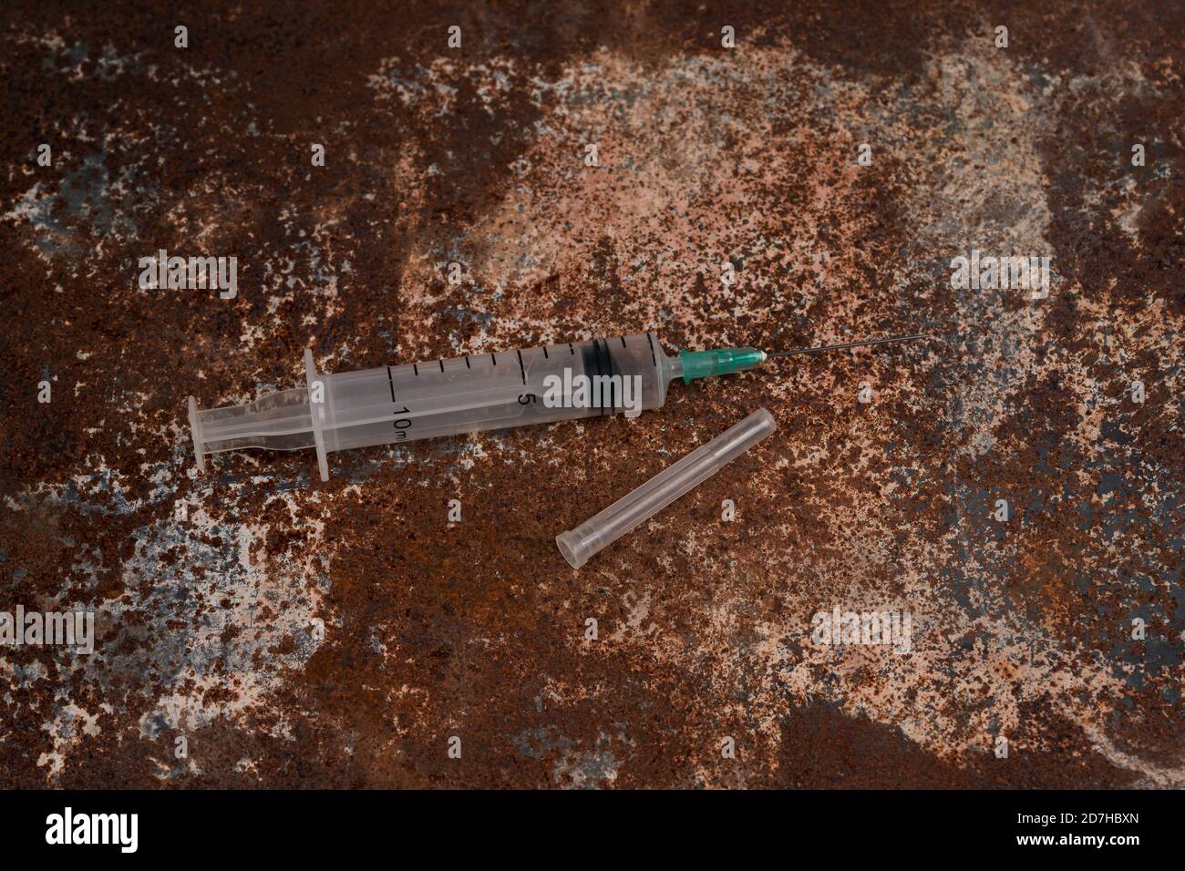 Syringe and drugs on dirty rusty background. Injection syringe ...