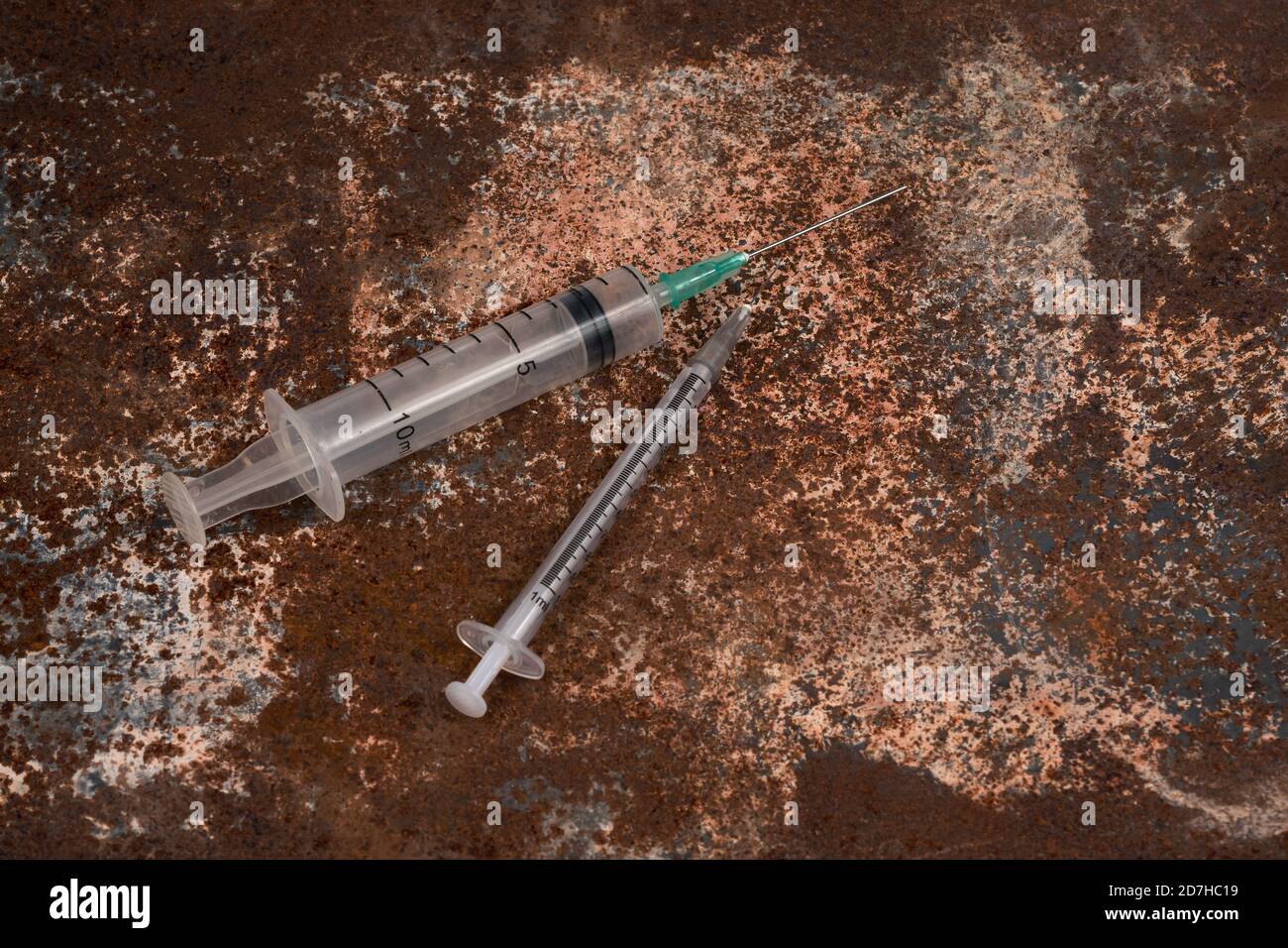 Syringe and drugs on dirty rusty background. Injection syringe ...