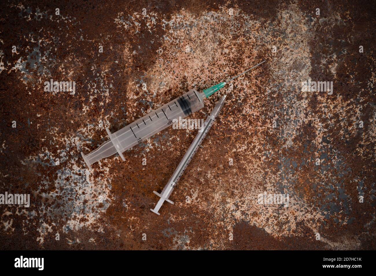 Syringe and drugs on dirty rusty background. Injection syringe ...