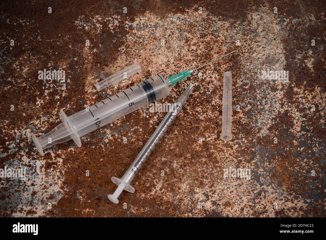 Syringe and drugs on dirty rusty background. Injection syringe ...