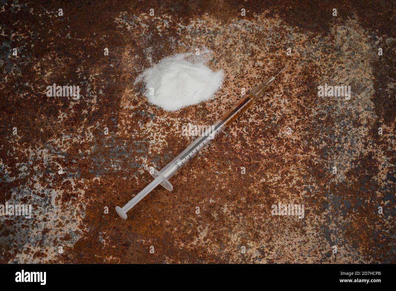 Syringe and drugs on dirty rusty background. Injection syringe ...