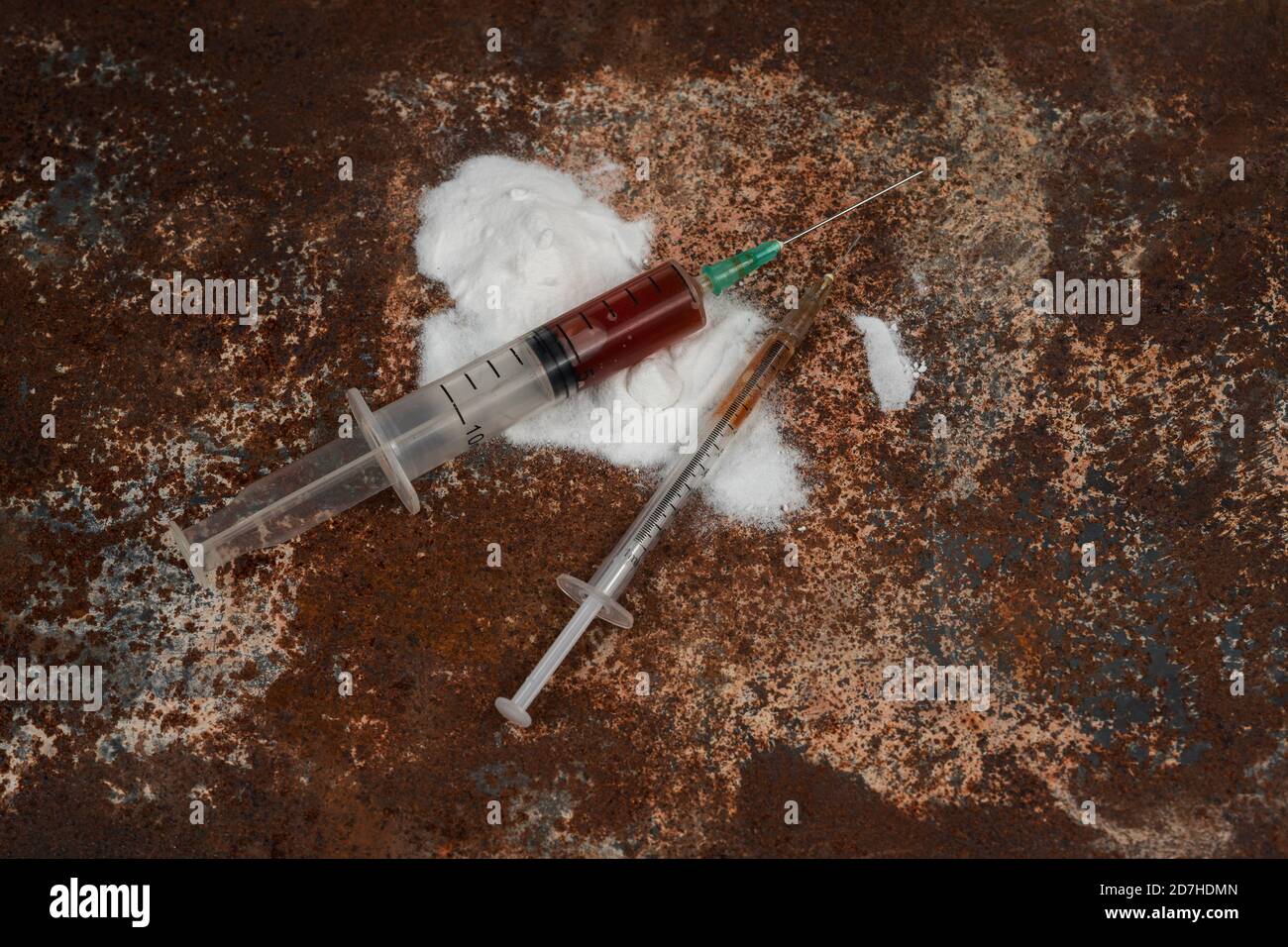 Syringe and drugs on dirty rusty background. Injection syringe ...