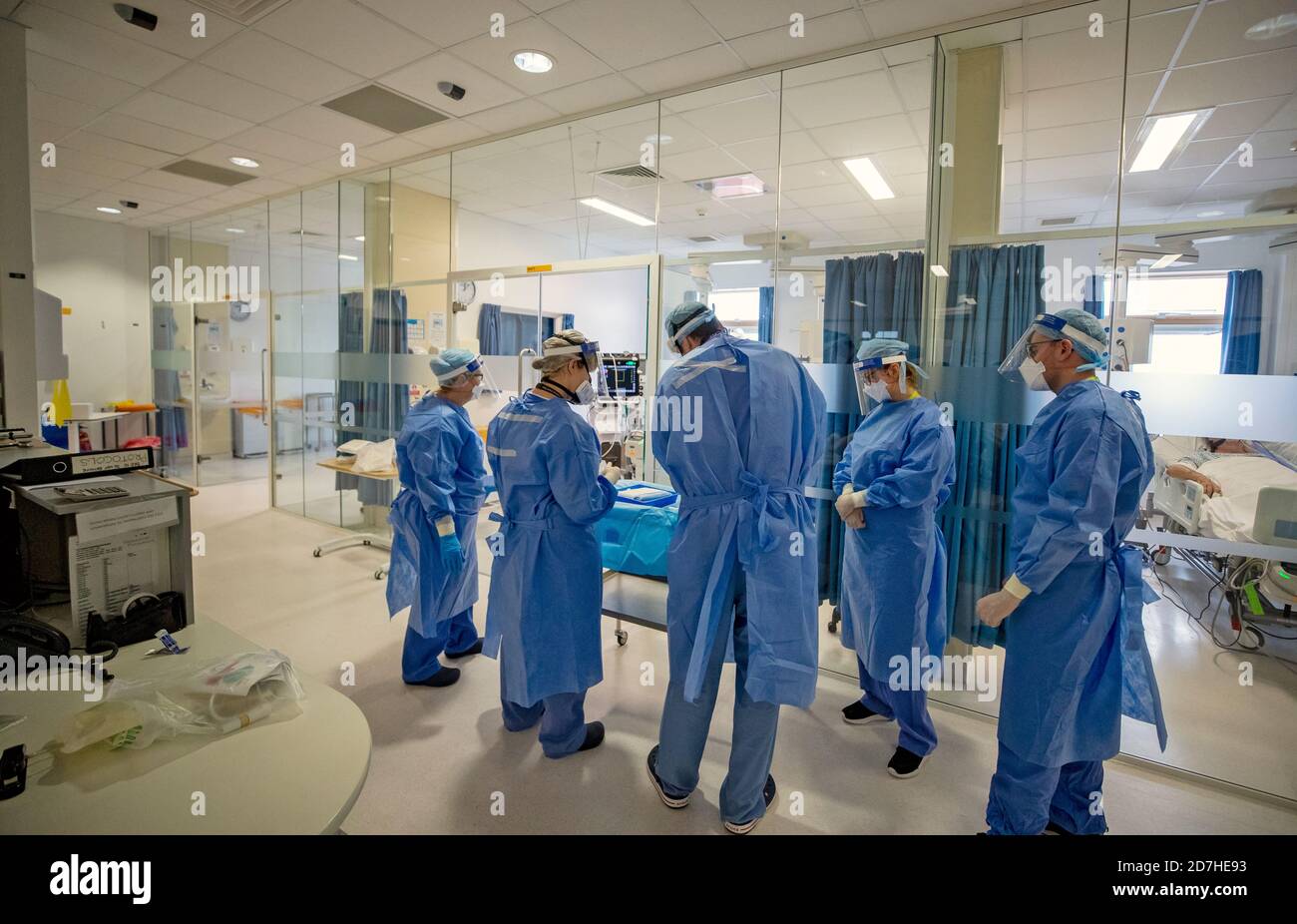 Health workers wearing full personal protective equipment (PPE) on the ...