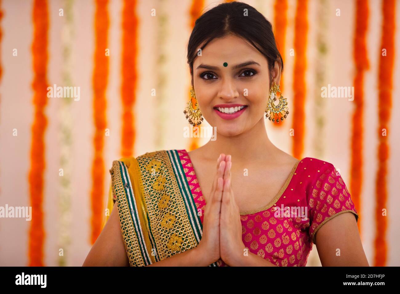 beautiful woman in a saree with her hands in namaste Stock Photo - Alamy