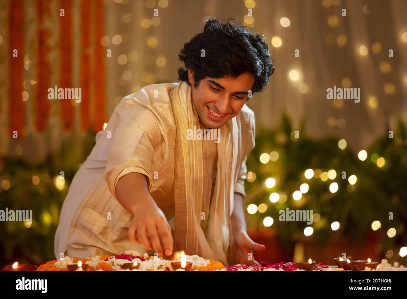 Bending down young man hi-res stock photography and images - Alamy
