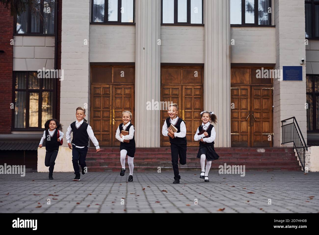 Children running school building hi-res stock photography and images ...